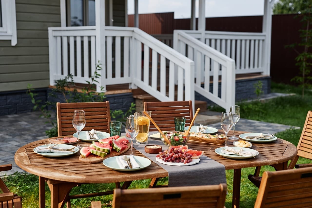 Outdoor Dining Bliss: Perfect Patio Table with Palm Casual